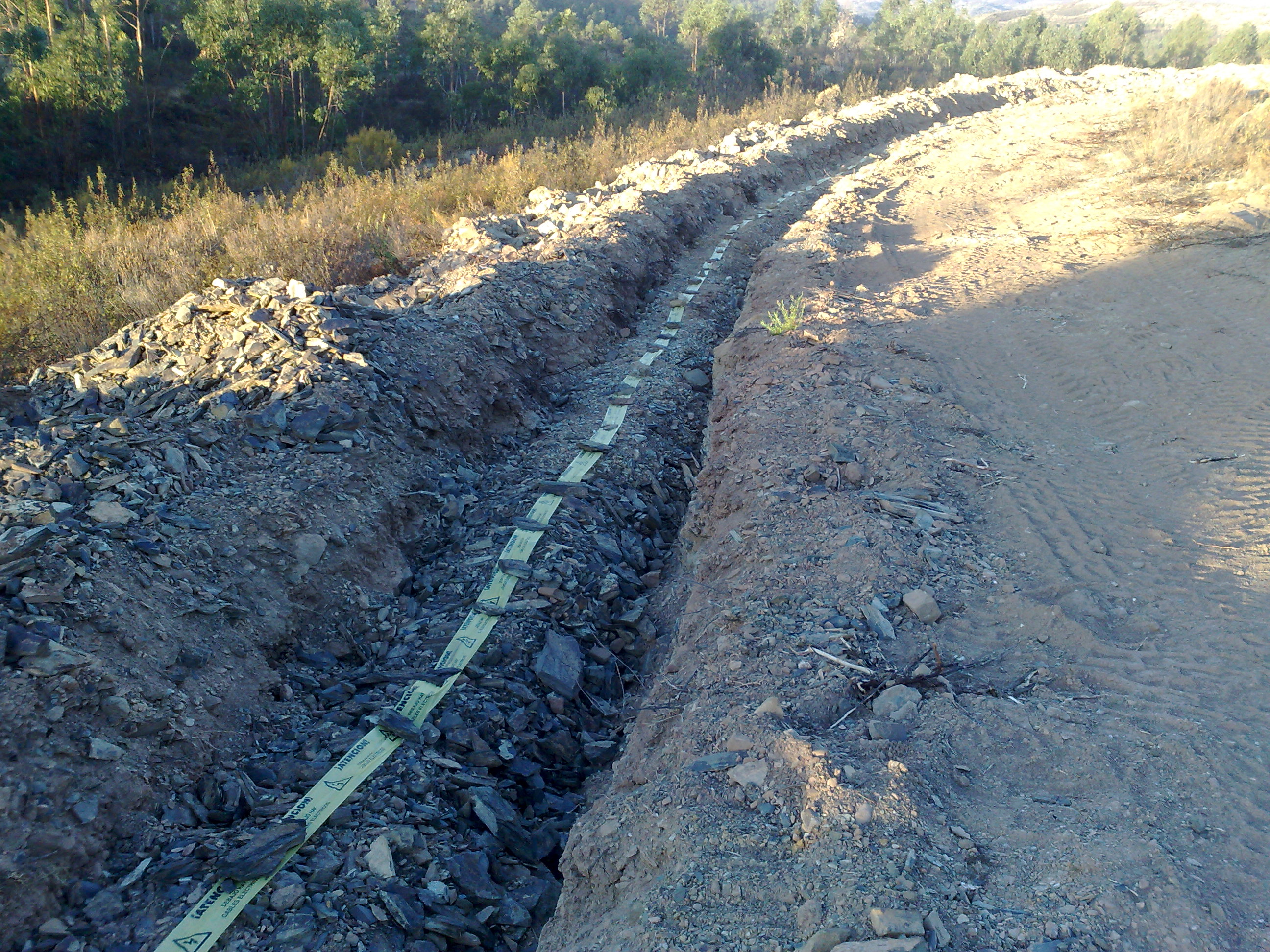 Trench backfilled with signalizing band | Wind farms construction
